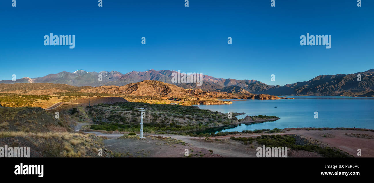 Panoramic view of Embalse Potrerillos Dam near Cordillera de Los Andes ...
