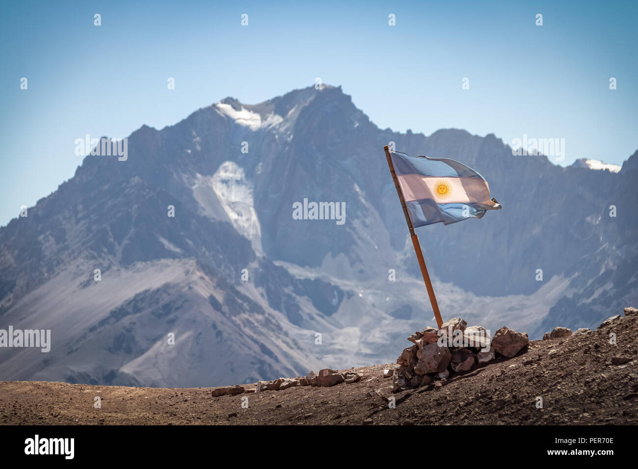 Argentina flag with Cerro Tolosa Mountain on background in Cordillera ...