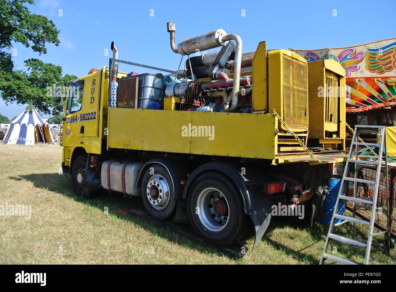 a Foden A8000 lorry with generator supplying power to fairground ride ...