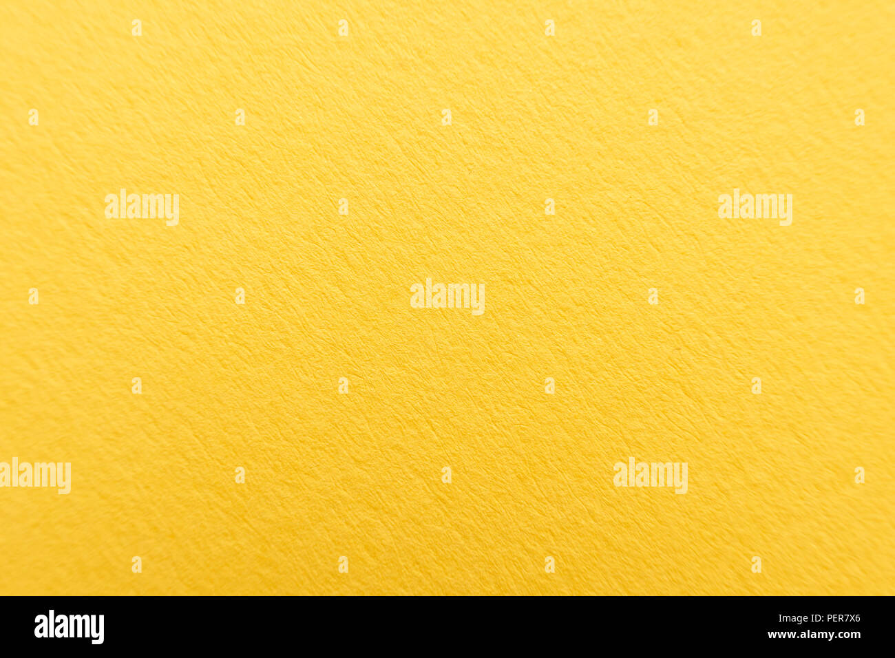 Yellow color cardboard texture desktop background Stock Photo - Alamy