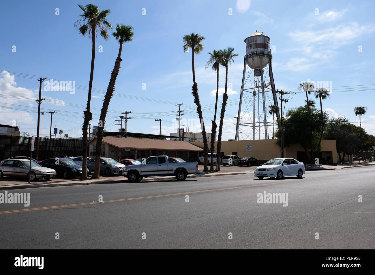 Calexico, California water tower surrounded by palms trees and the ...