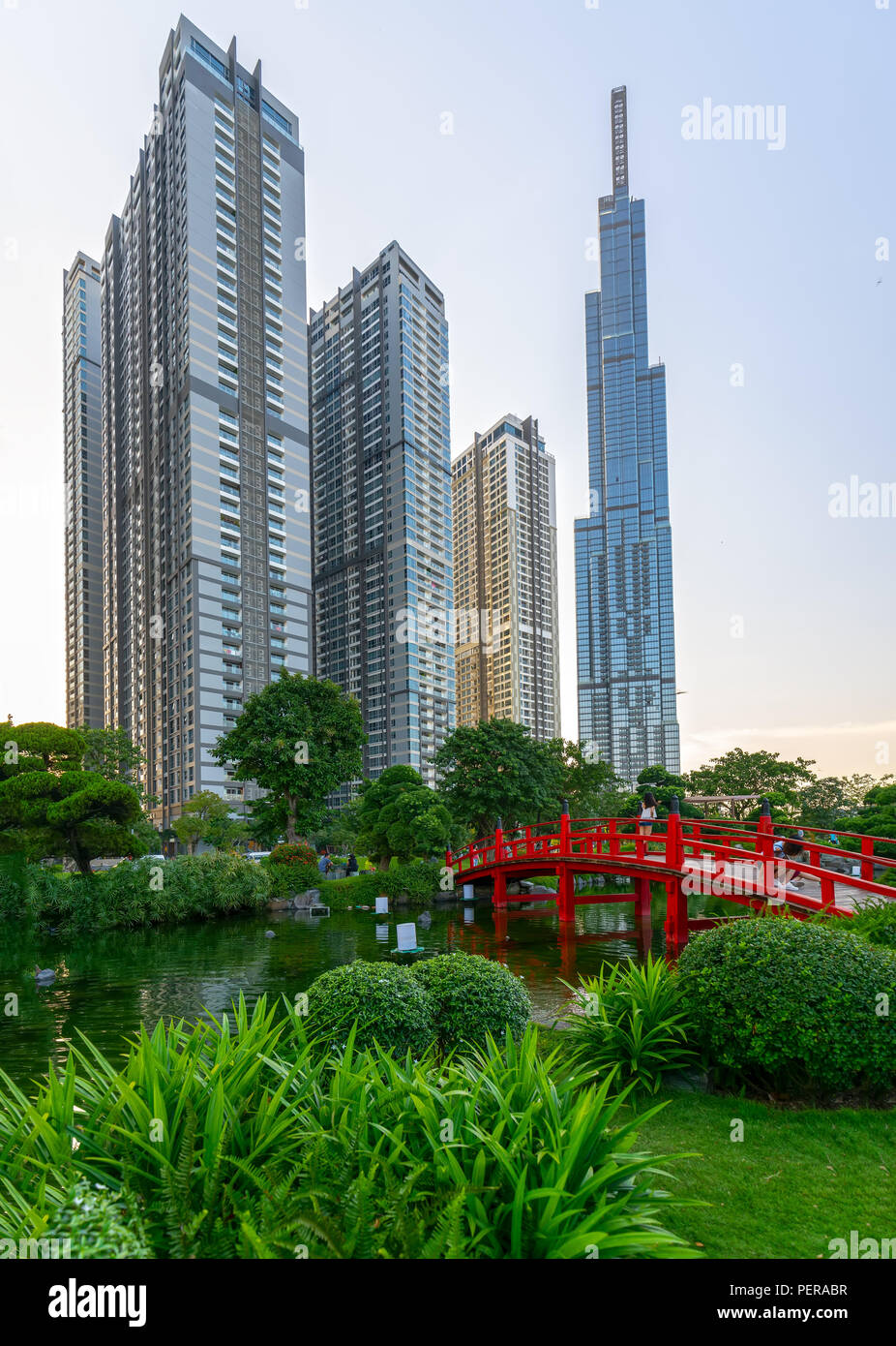 Path bridge over central park in busy urban areas showing prosperous ...