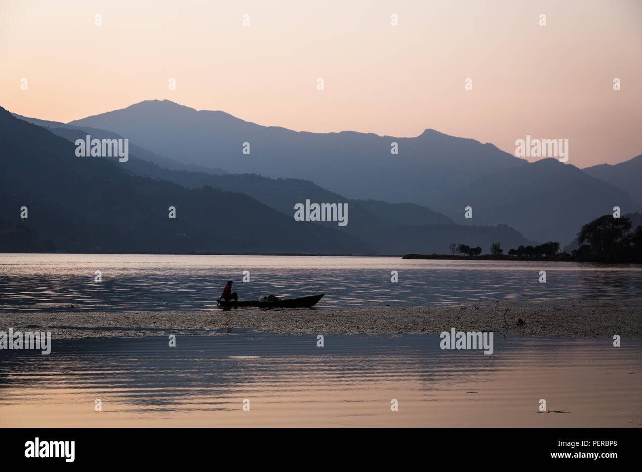Sunset over the stunning Phewa lake in Pokhara at the feet of the ...
