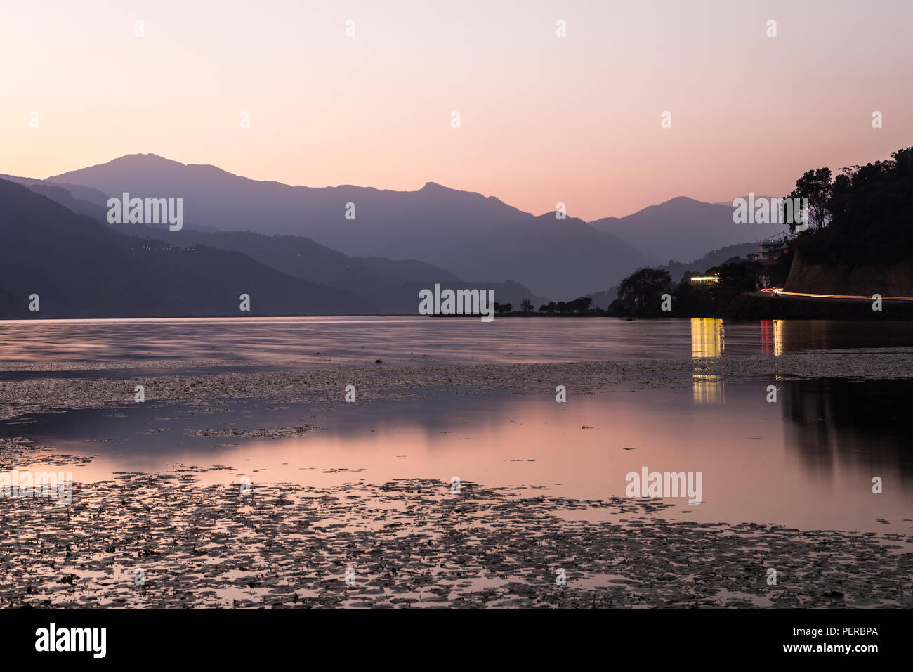 Sunset over the stunning Phewa lake in Pokhara at the feet of the ...
