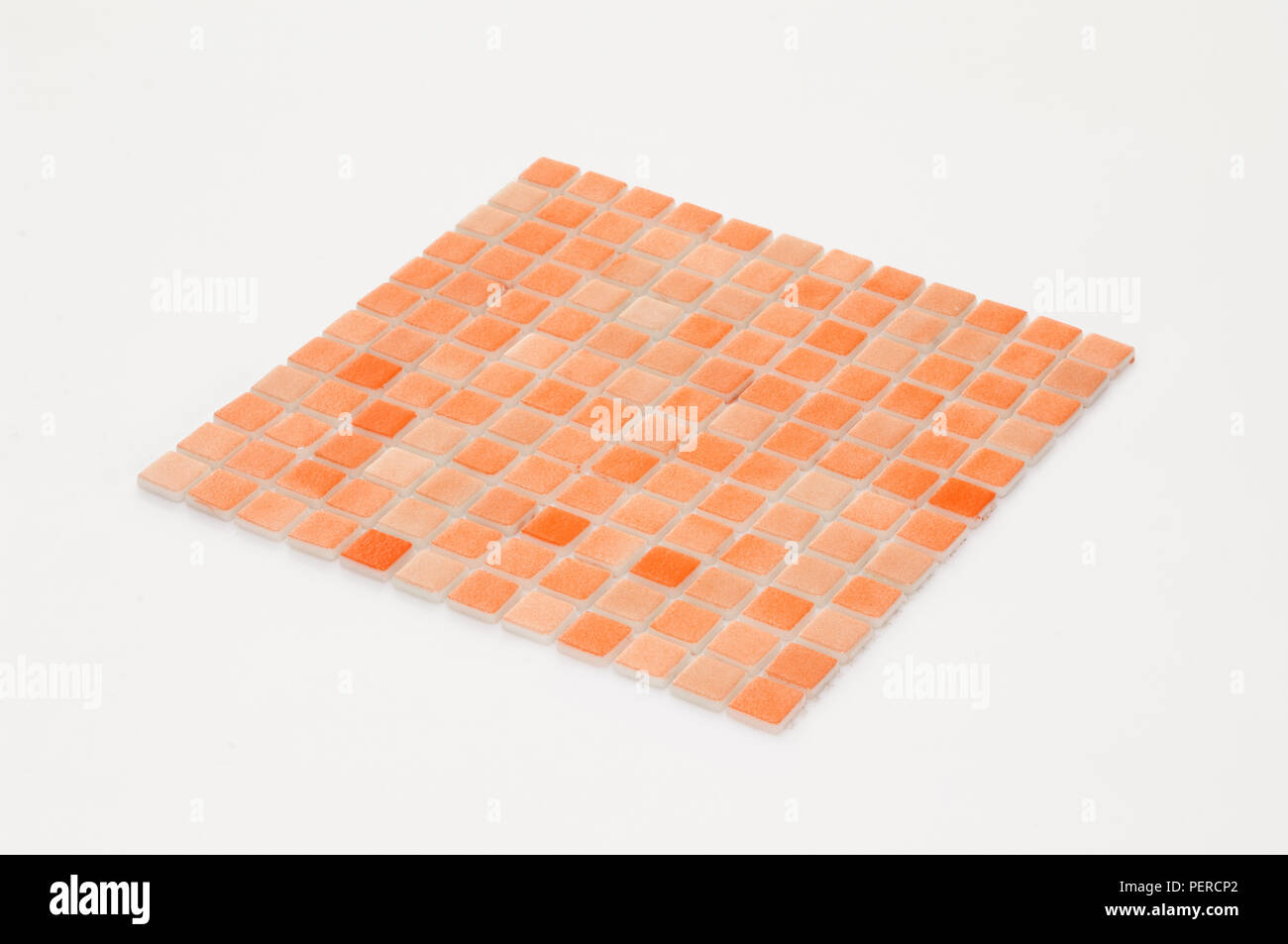 little orange ceramic tile on a white background, majolica. for the ...