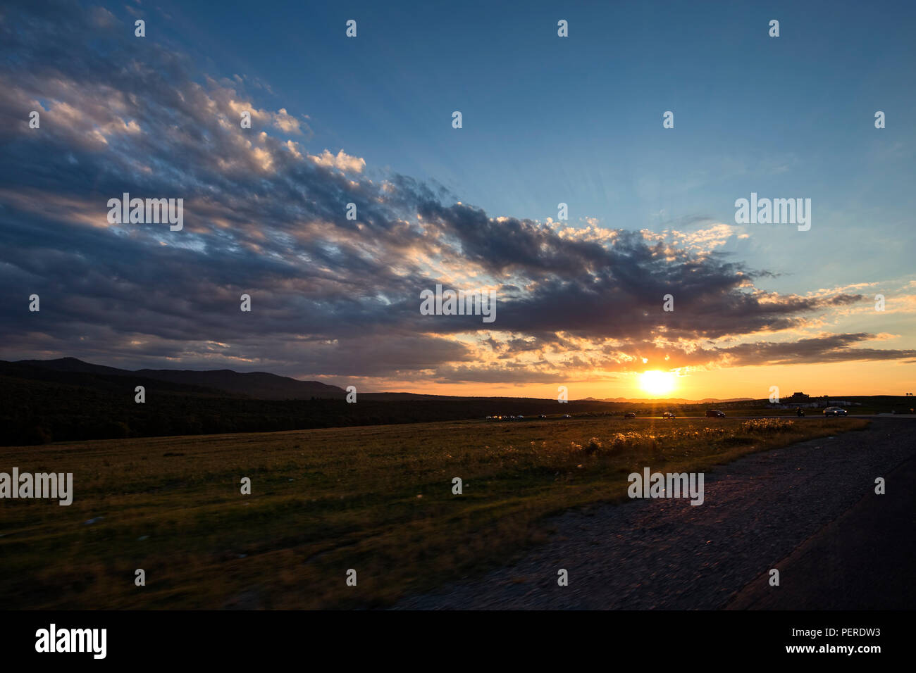 Beautiful landscape at sunset. Transylvania, Romania with road and cars ...