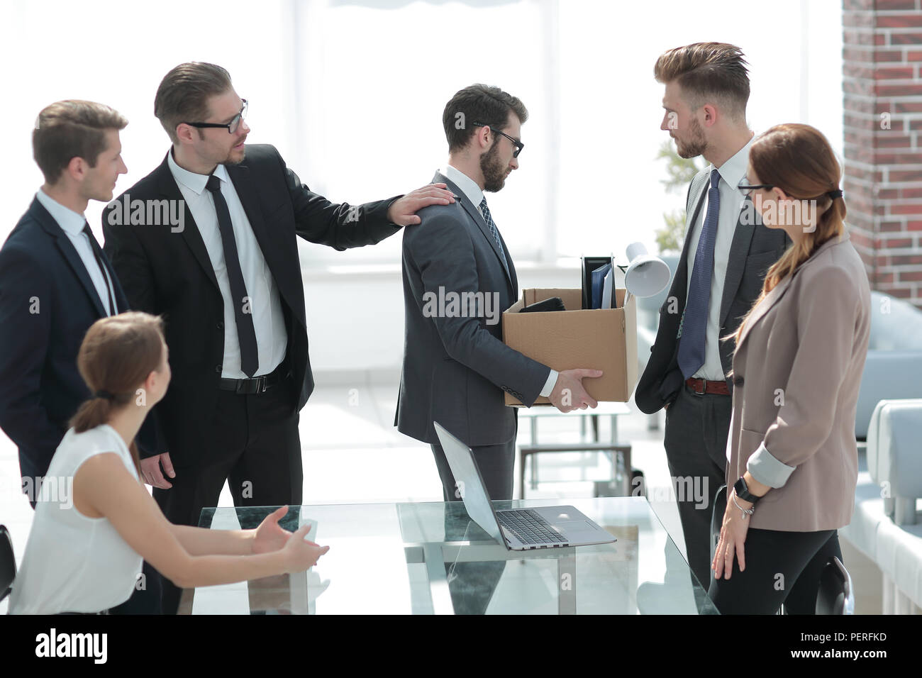 business team and frustrated employee with personal things Stock Photo ...