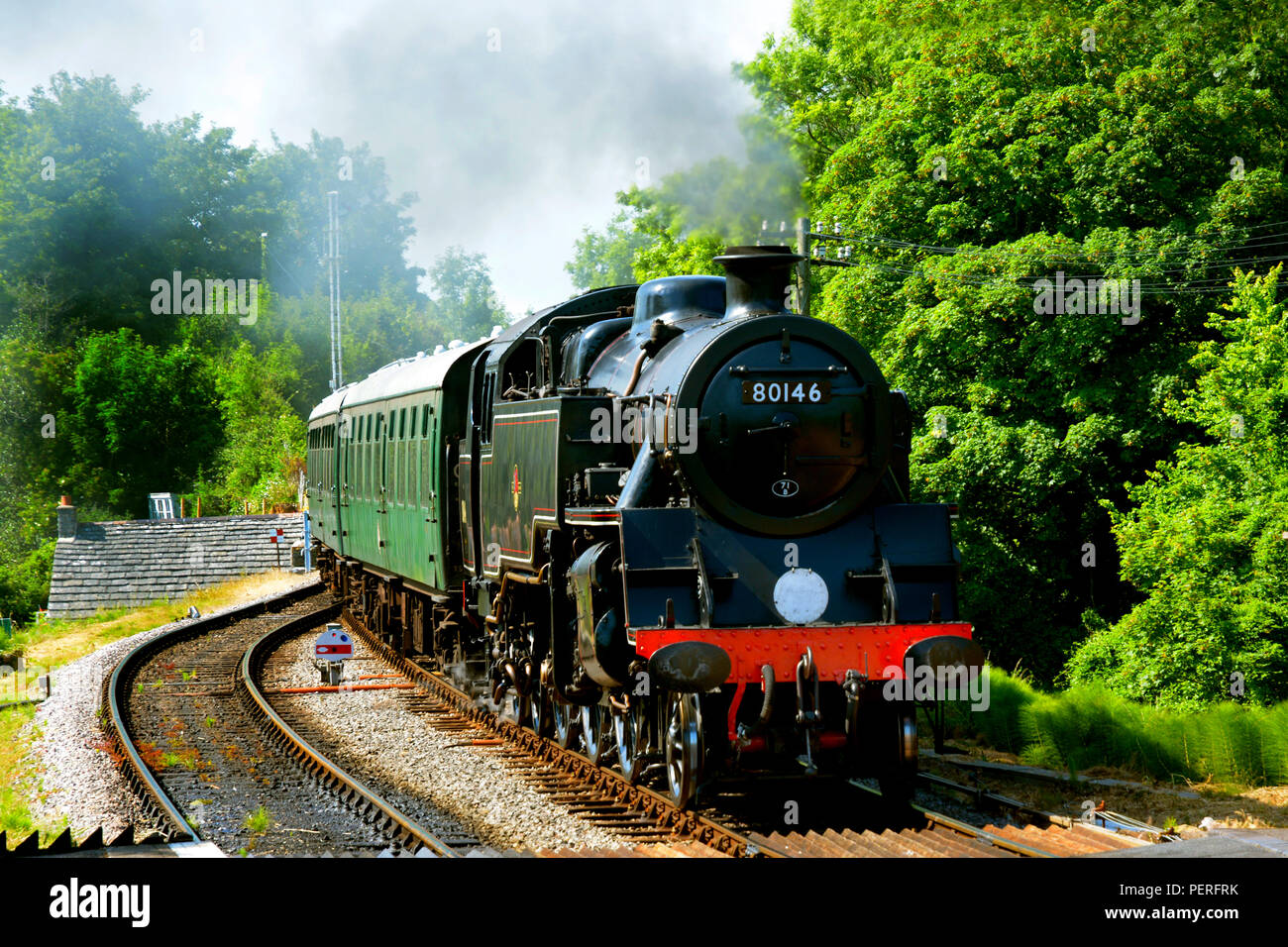 Steam train at Corfe Castle Stock Photo - Alamy
