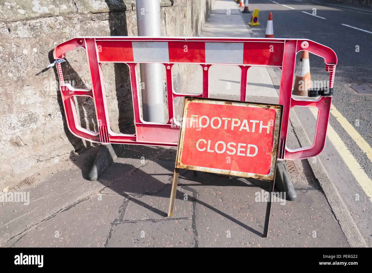 Footpath closed sign for pedestrian safety from road construction on ...