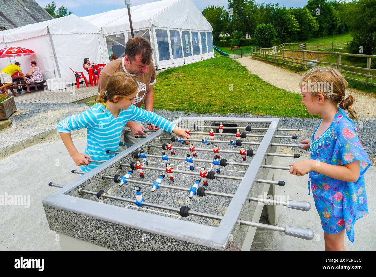 father and children playing table football/ Fussball / Fußball Stock ...