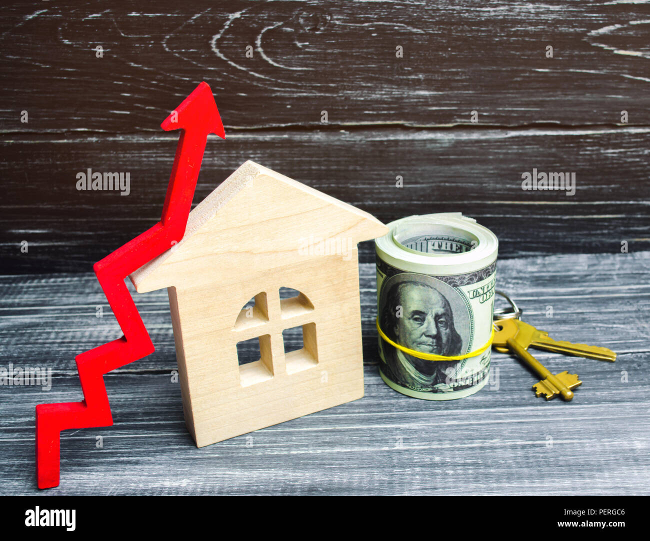wooden house, dollars and keys with a red arrow up. concept of high ...