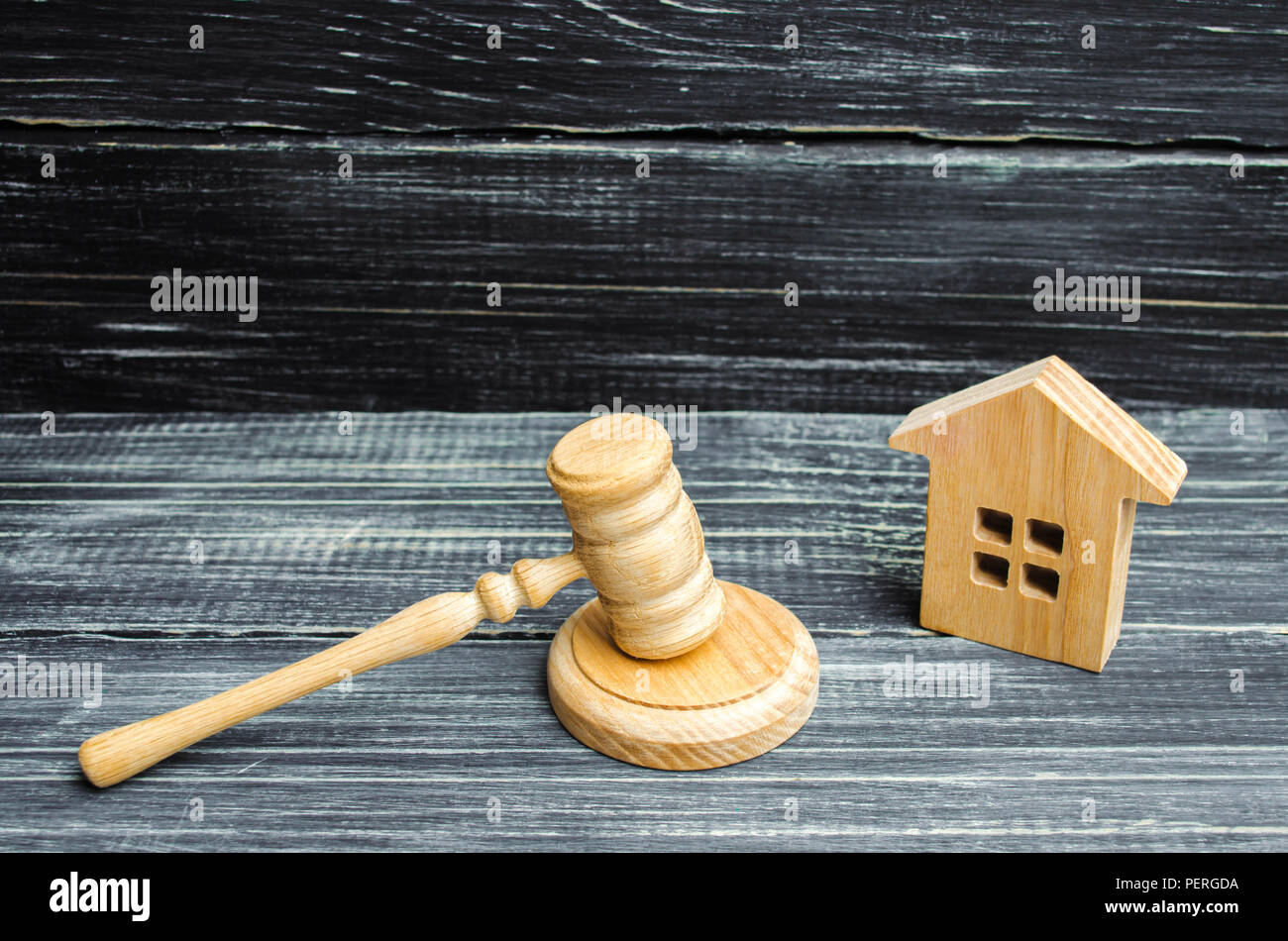 wooden house and a hammer of the judge on a black background. Court ...