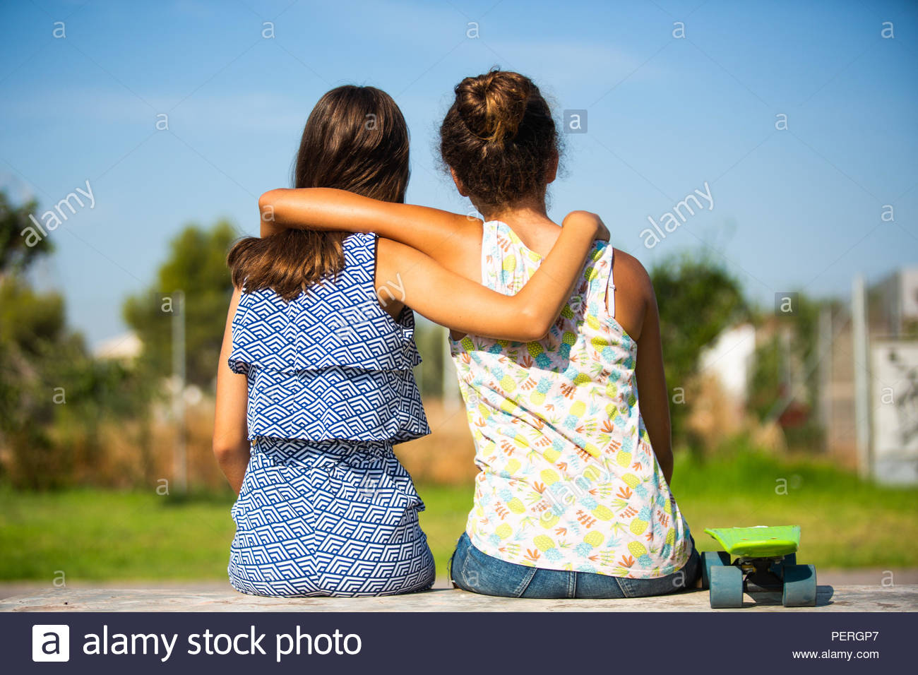 Two Girls Sitting Backs Together Stock Photos & Two Girls Sitting Backs ...