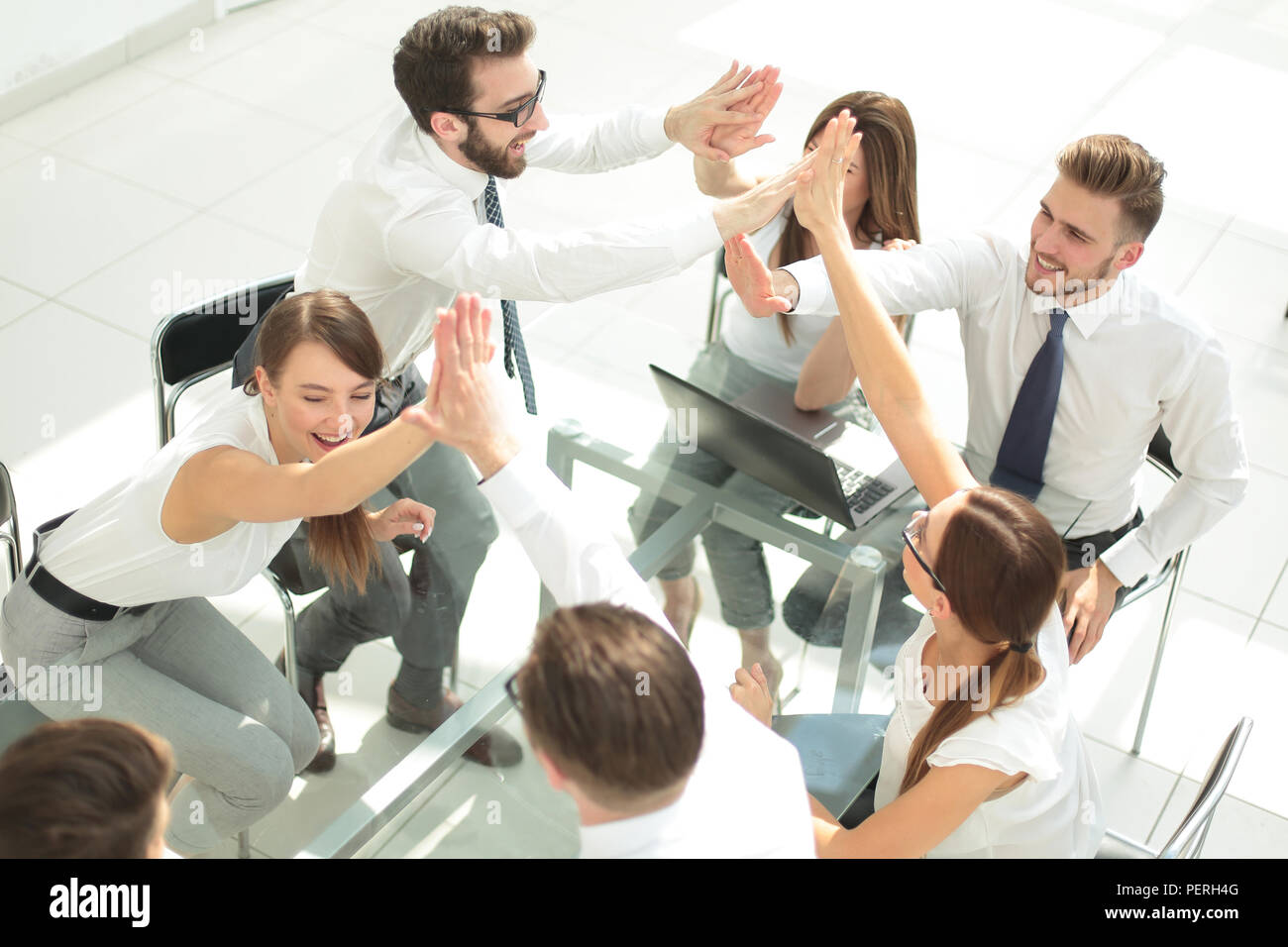 business team congratulates each other on the achievement, giving a ...