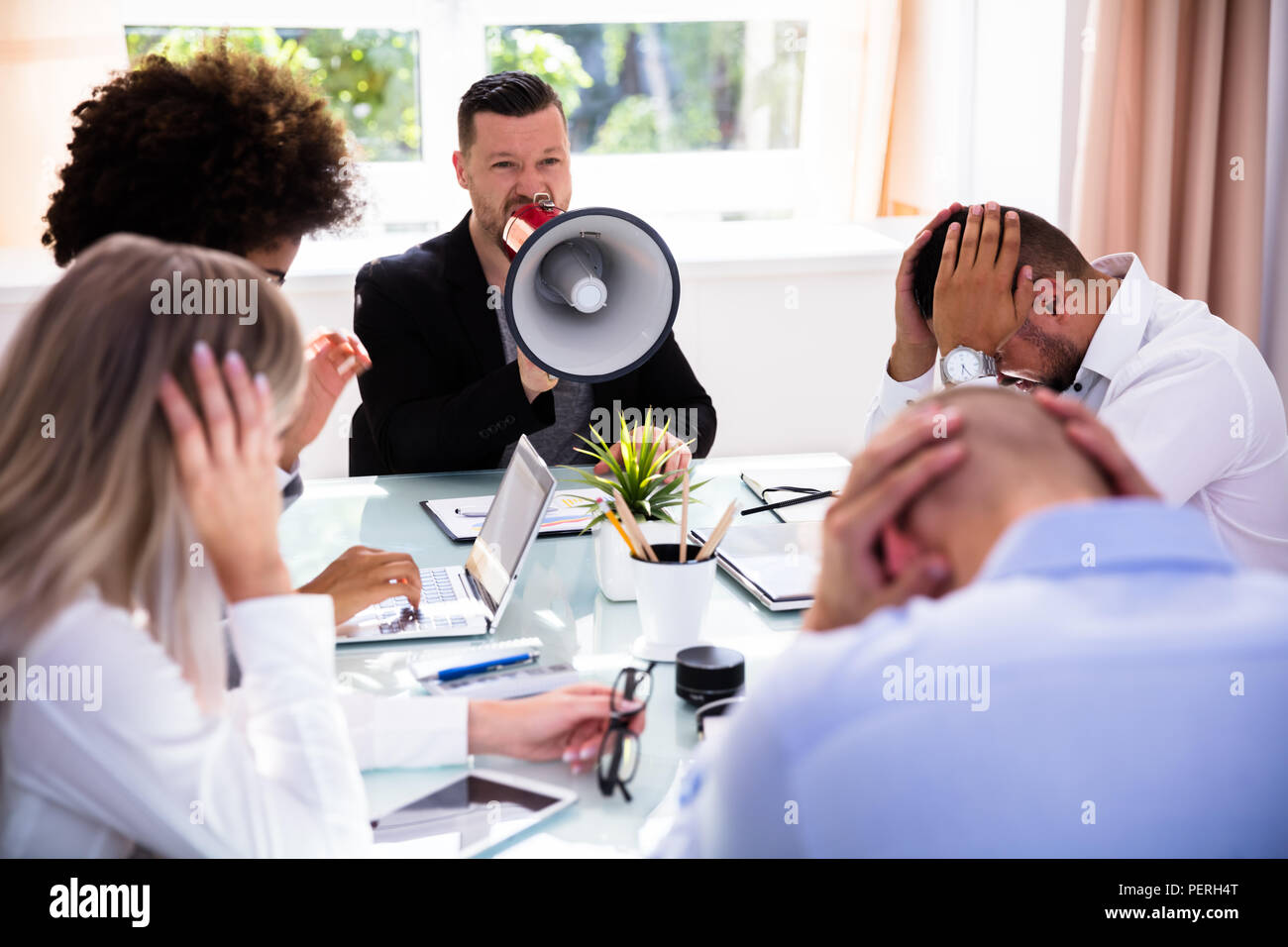 Angry Businessman Shouting At His Colleagues Through Megaphone Stock ...