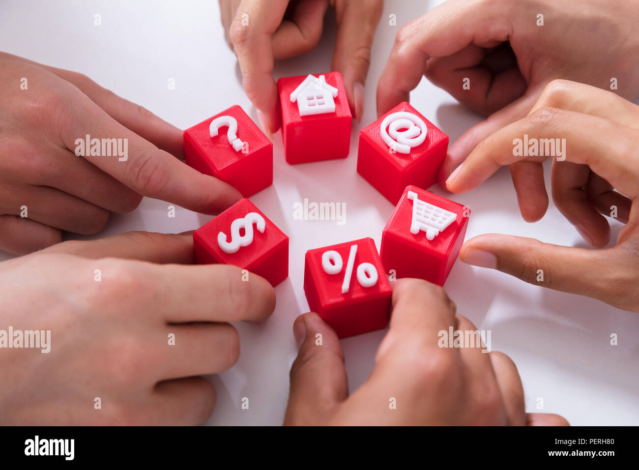 Close-up Of People Holding Red Cubic Blocks With Vivid Icons On White ...