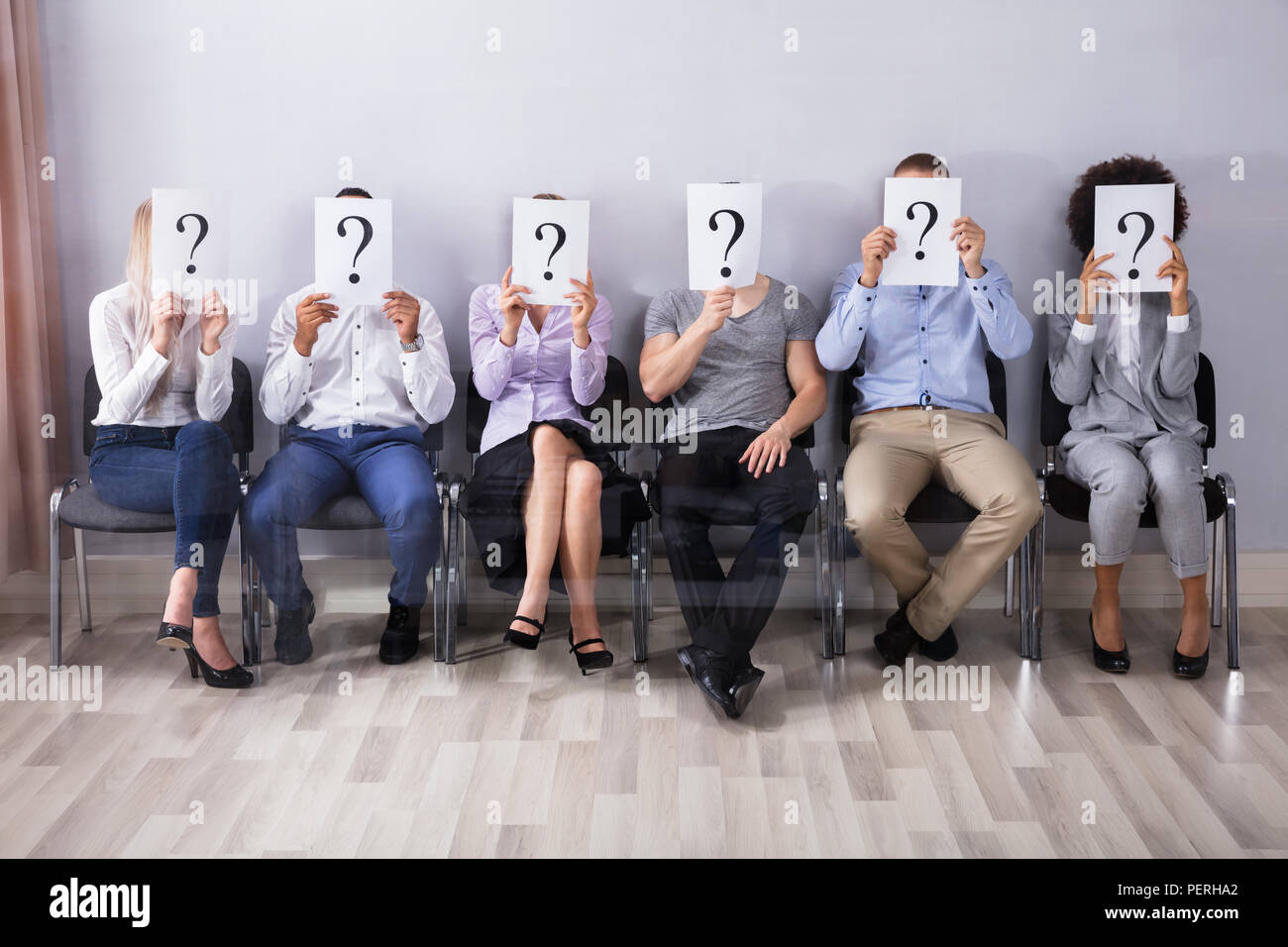People Holding Question Mark Sign In Front Of Their Face Stock Photo ...