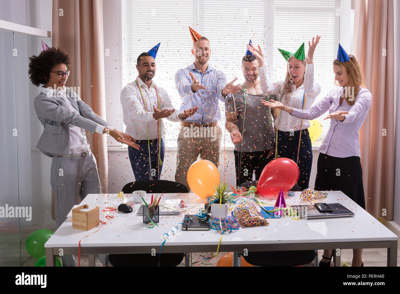 Group Of Young Businesspeople Celebrating New Year Party In Office ...