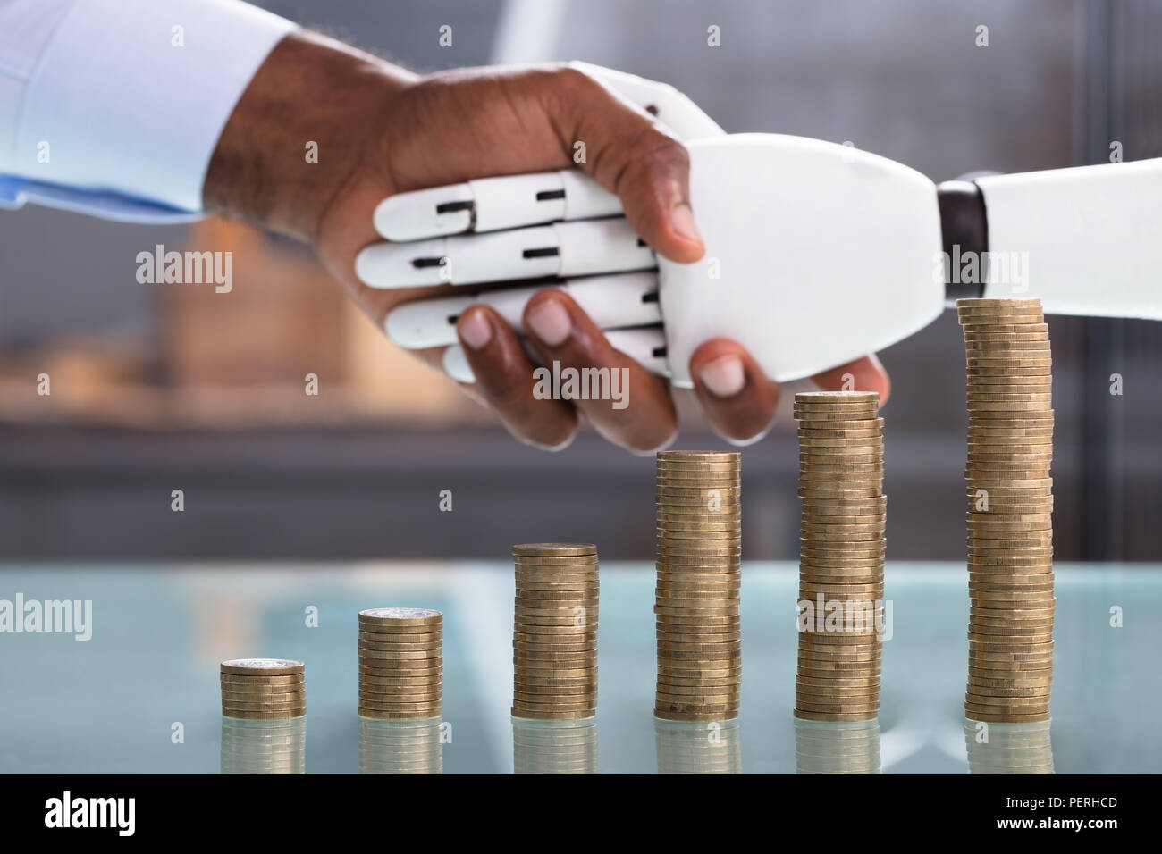 Hand shaking coin computer hi-res stock photography and images - Alamy