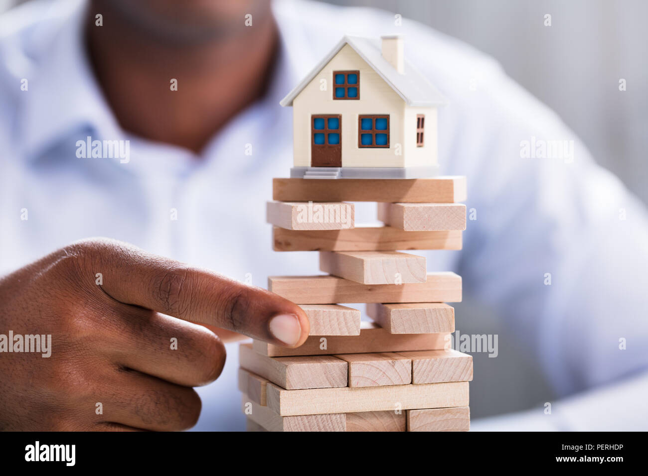 Man building up house building blocks hi-res stock photography and ...
