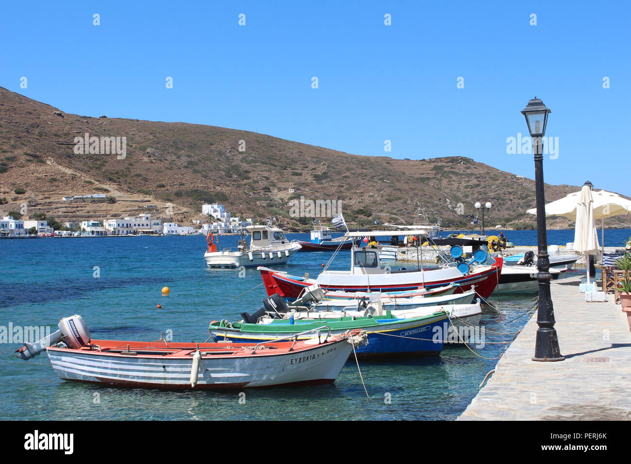 Boats along the marina dock in Amorgos Greece Stock Photo - Alamy