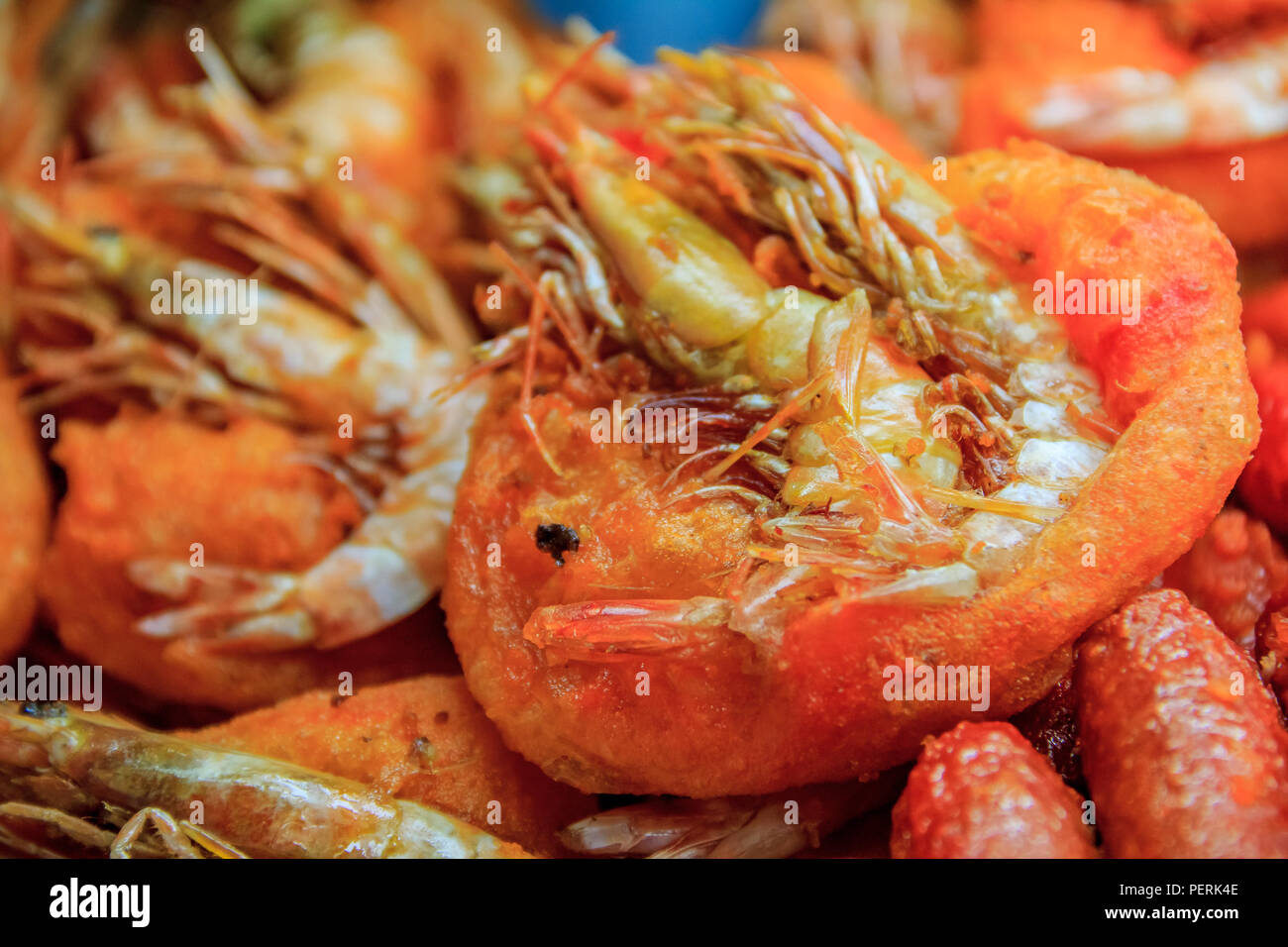 Indian prawn pakora or prawn fritters at a market in Little India part ...