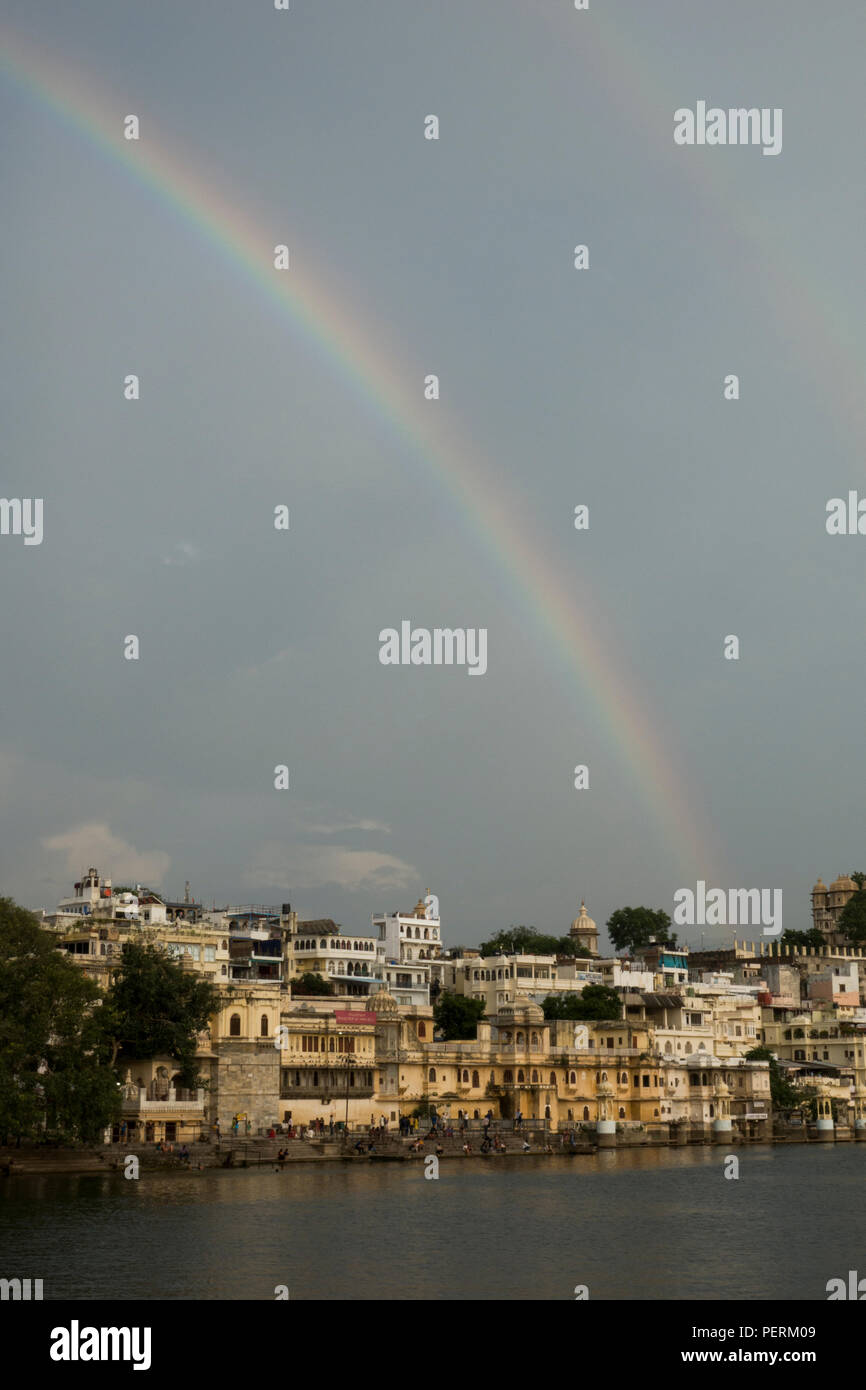 Rainbow over Gangaur Ghat, Lal Ghat and City Palace on Lake Pichola ...