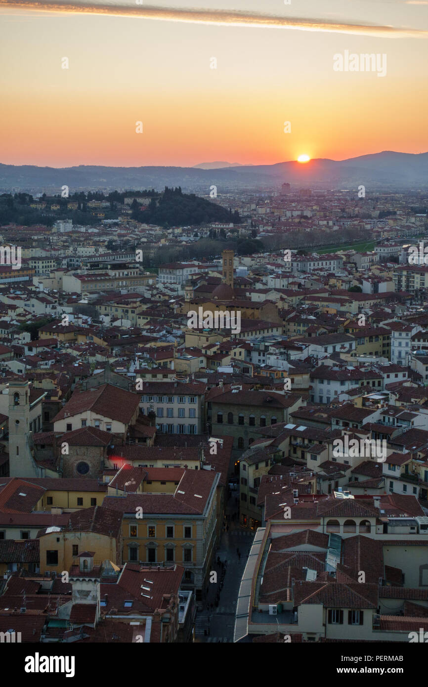 Florence, Italy - March 23, 2018: The sun sets over the hills of ...