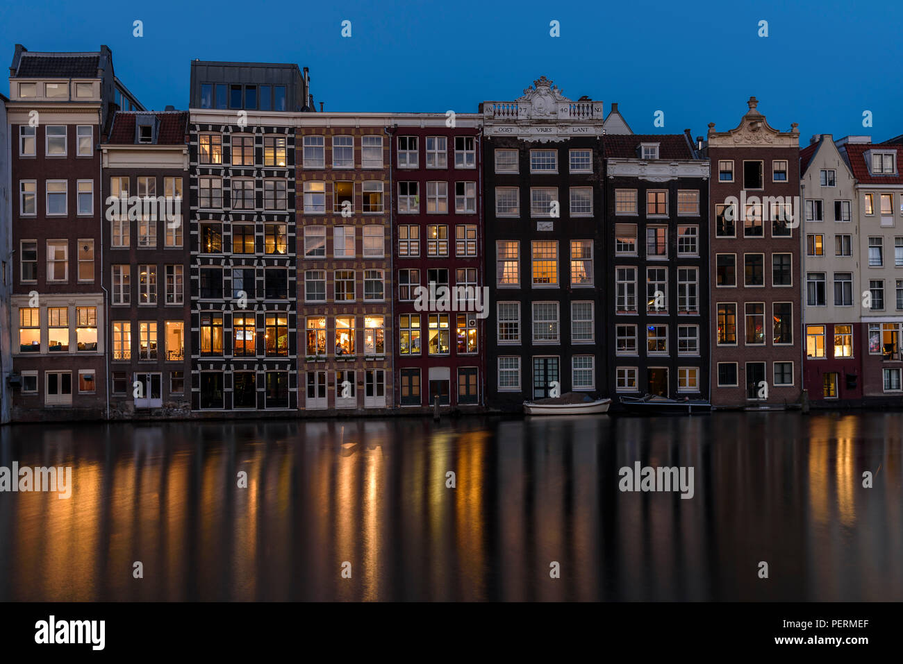 Tall buildings in Amsterdam, at disk, with the lights from the windows ...