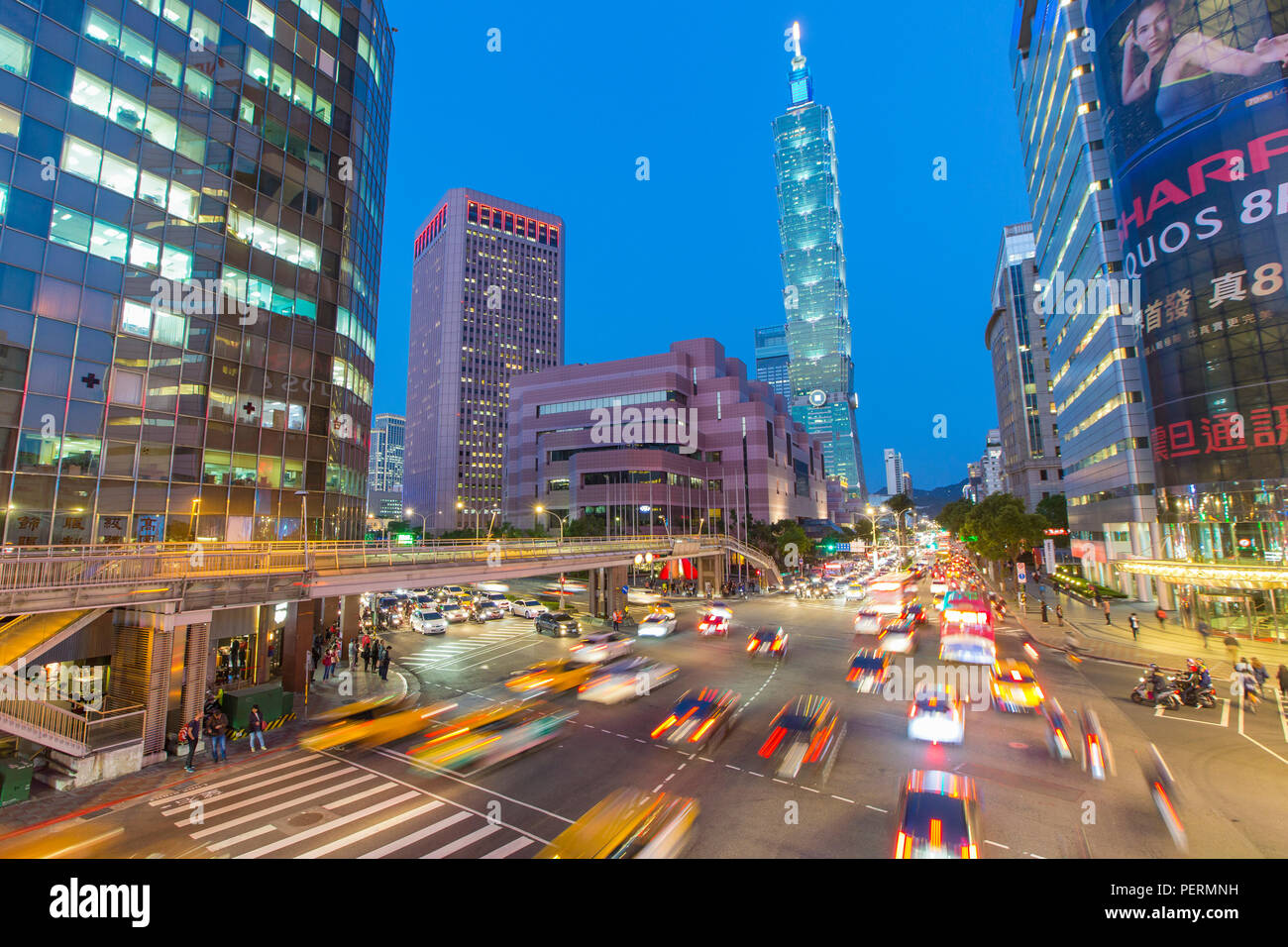 Taiwan, Taipei, traffic in front of Taipei 101 at a busy downtown ...