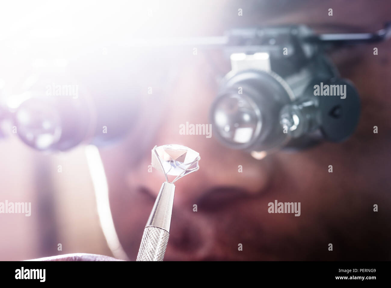 Macro Shot Of A Person Looking At Diamond With Magnifying Loupe Stock ...