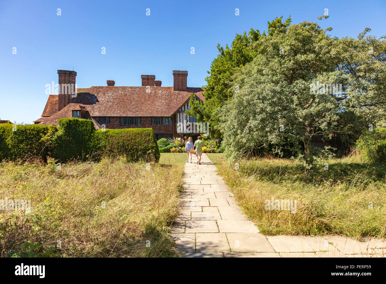 The House at Great Dixter, two visitors approach the porch through the ...