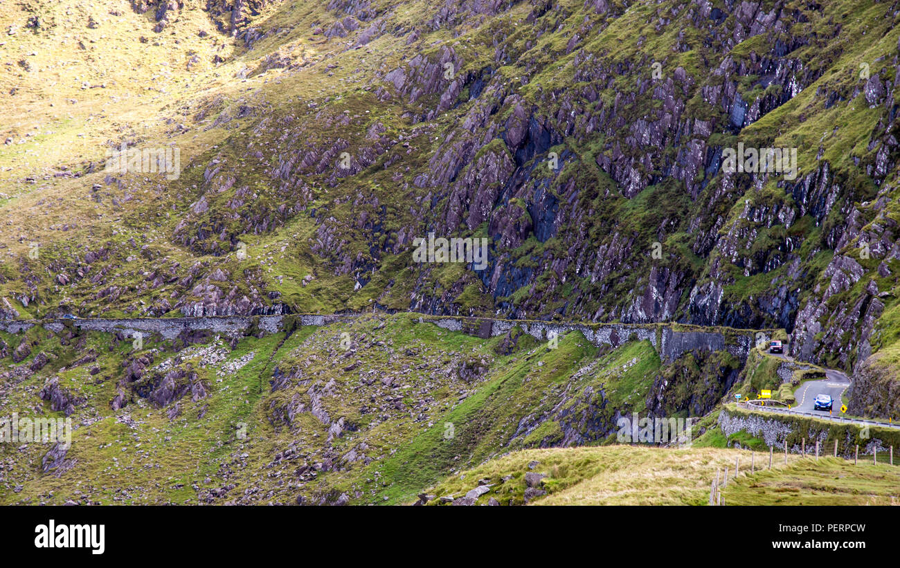 Touring motorists cross the mountains of Ireland's Dingle Peninsula on ...