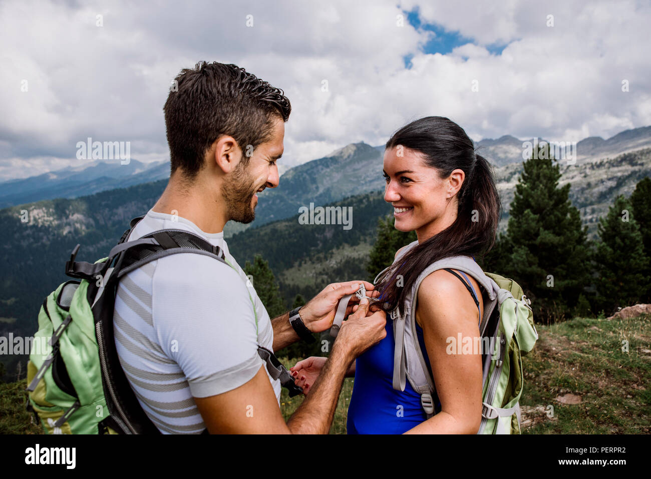 Couple making trekking on the mountain Stock Photo - Alamy