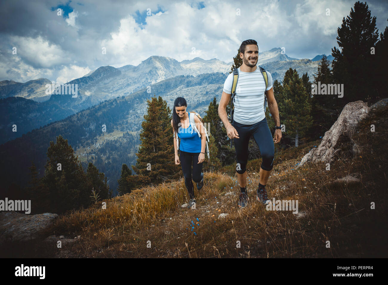 Couple making trekking on the mountain Stock Photo - Alamy