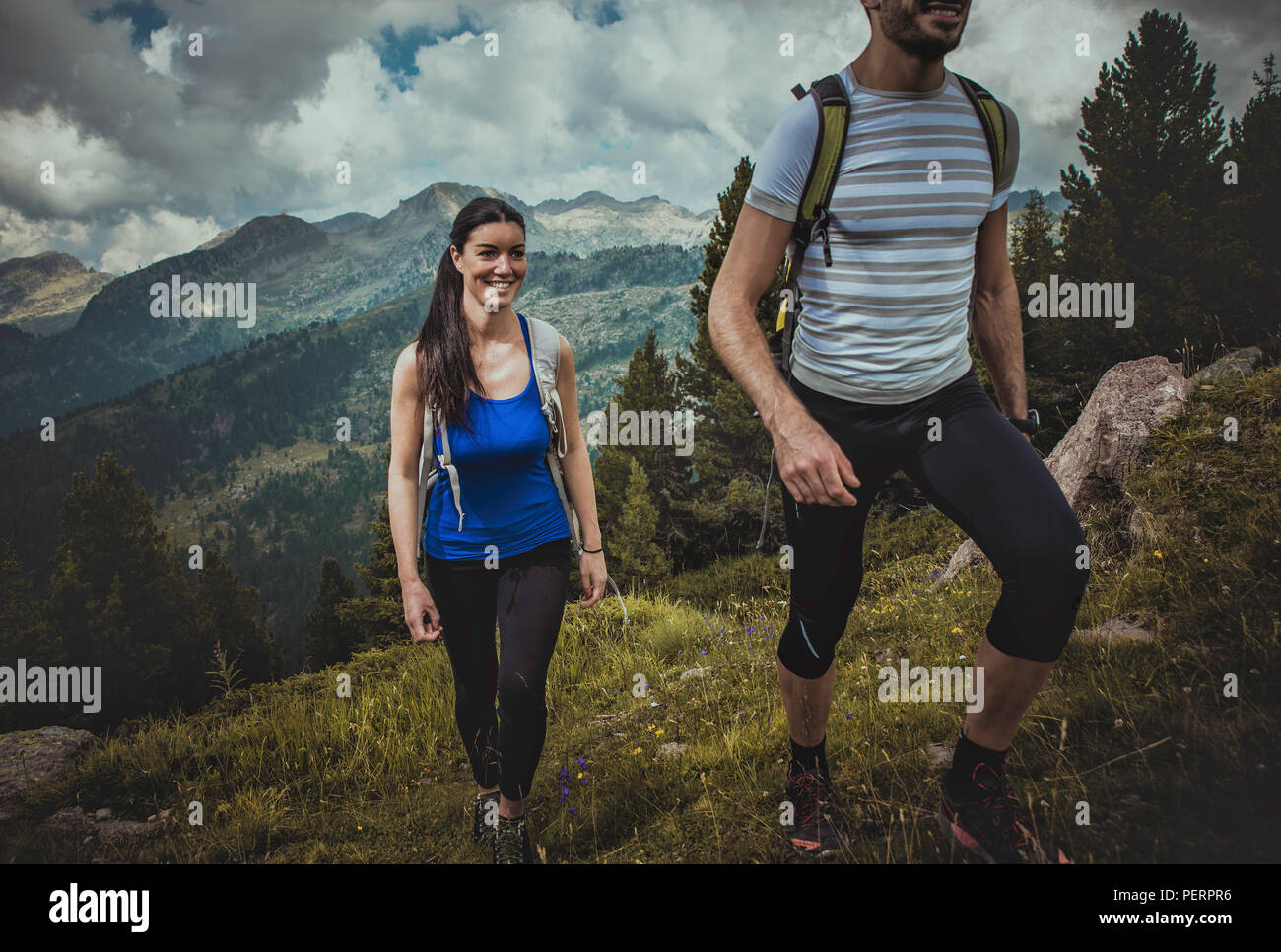 Couple making trekking on the mountain Stock Photo - Alamy