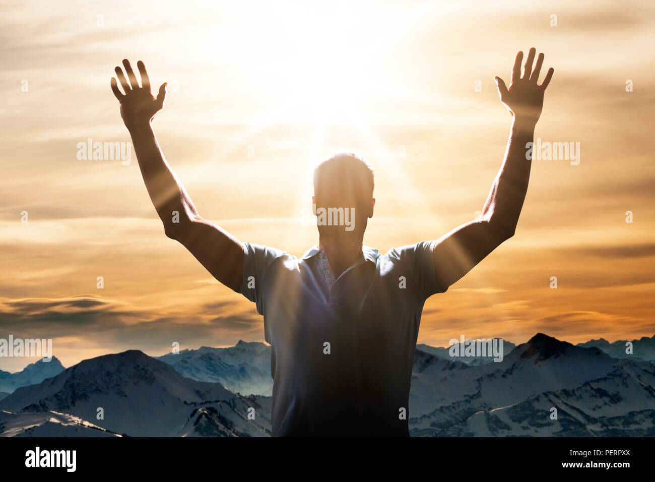 Man Raising His Arm In Front Of Mountain Landscape Stock Photo - Alamy
