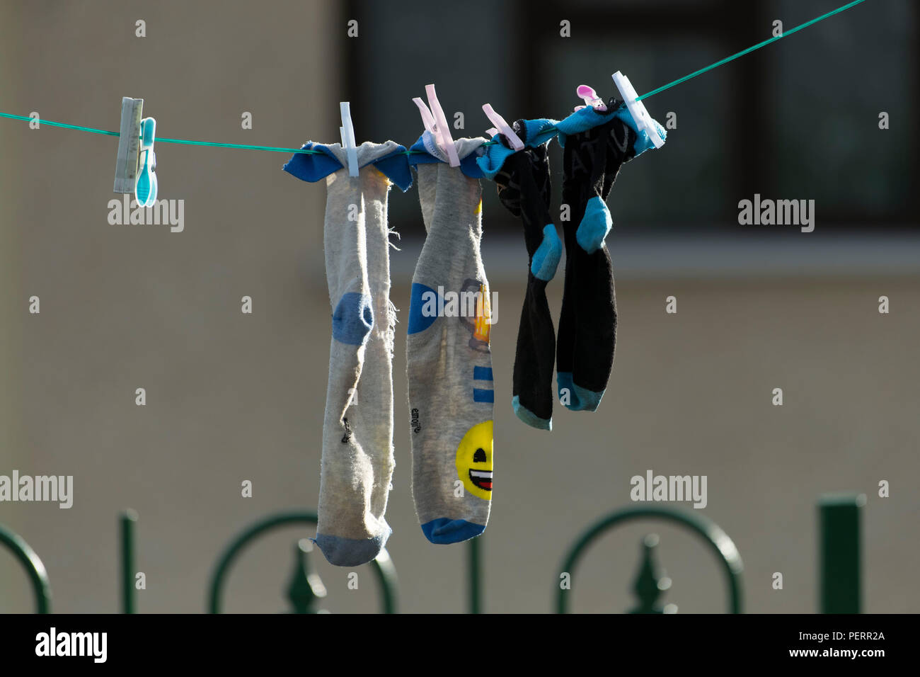 Socks seen drying hanging on a washing line in a housing estate in New ...