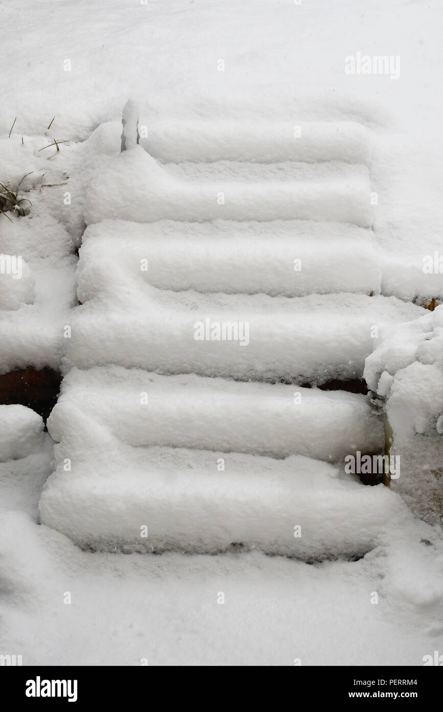 Snow-covered garden steps Stock Photo - Alamy