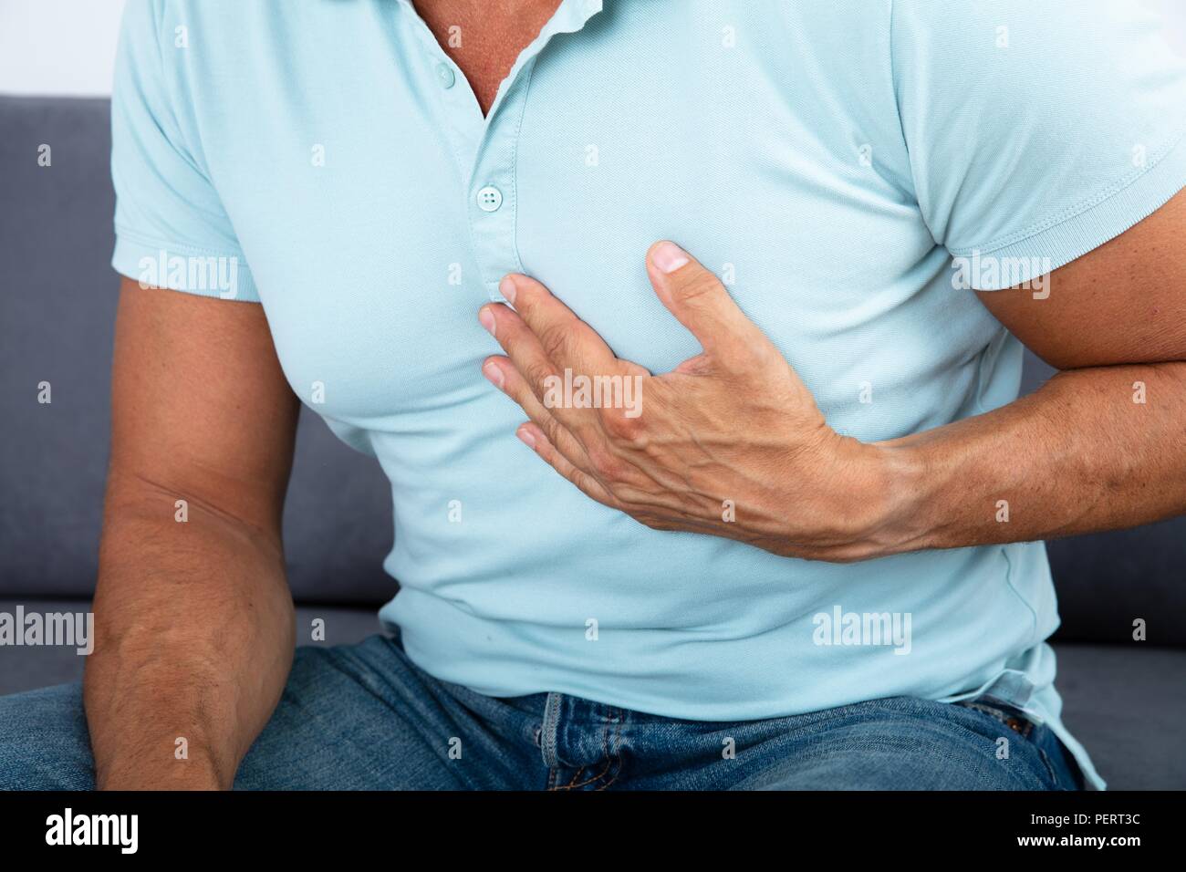 Close-up Of A Man With Chest Pain Suffering From Heart Attack Stock ...