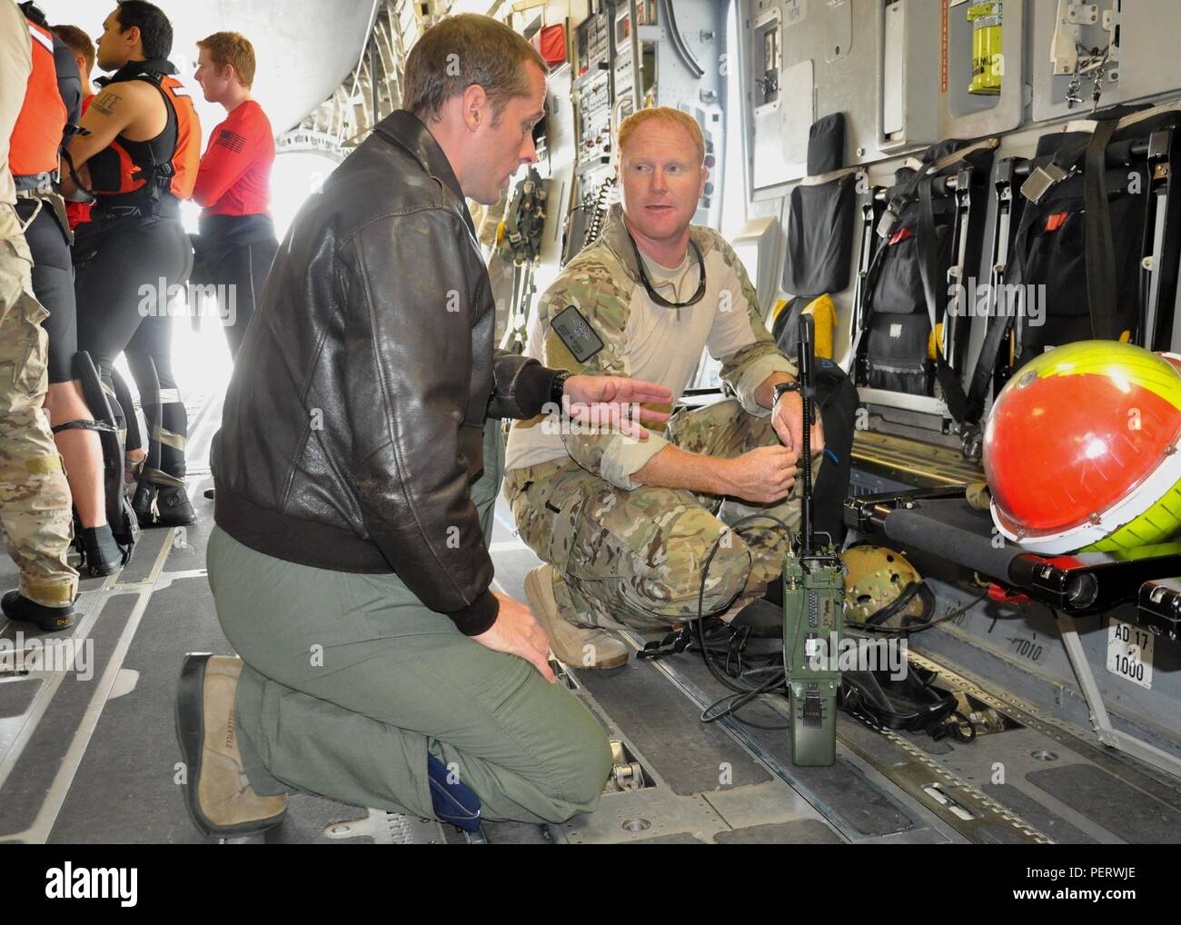 Maj. Chris Slauson, 45th Operations Group Detachment 3, discusses radio ...