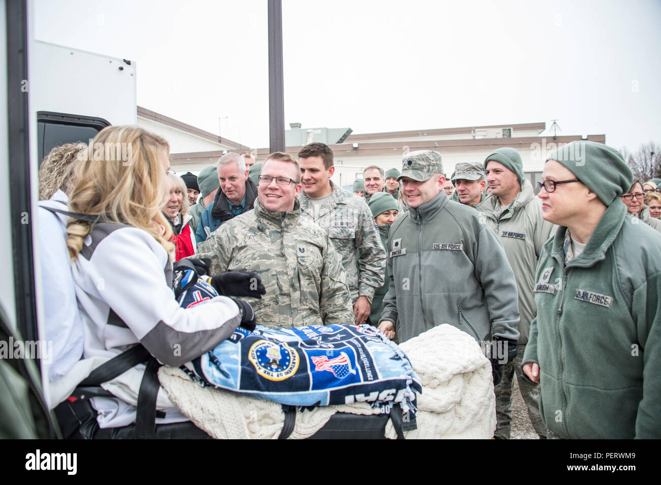 Staff Sgt. Taylor Savage is greeted by nearly 100 members of the 133rd ...