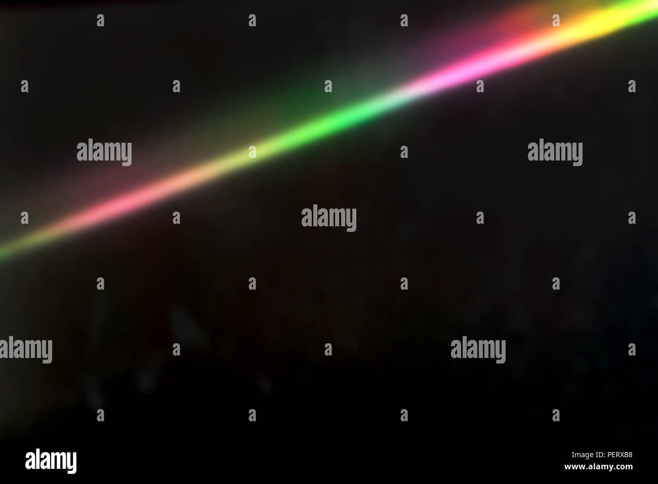 Abstract diagonal rainbow color light streak on black Stock Photo - Alamy
