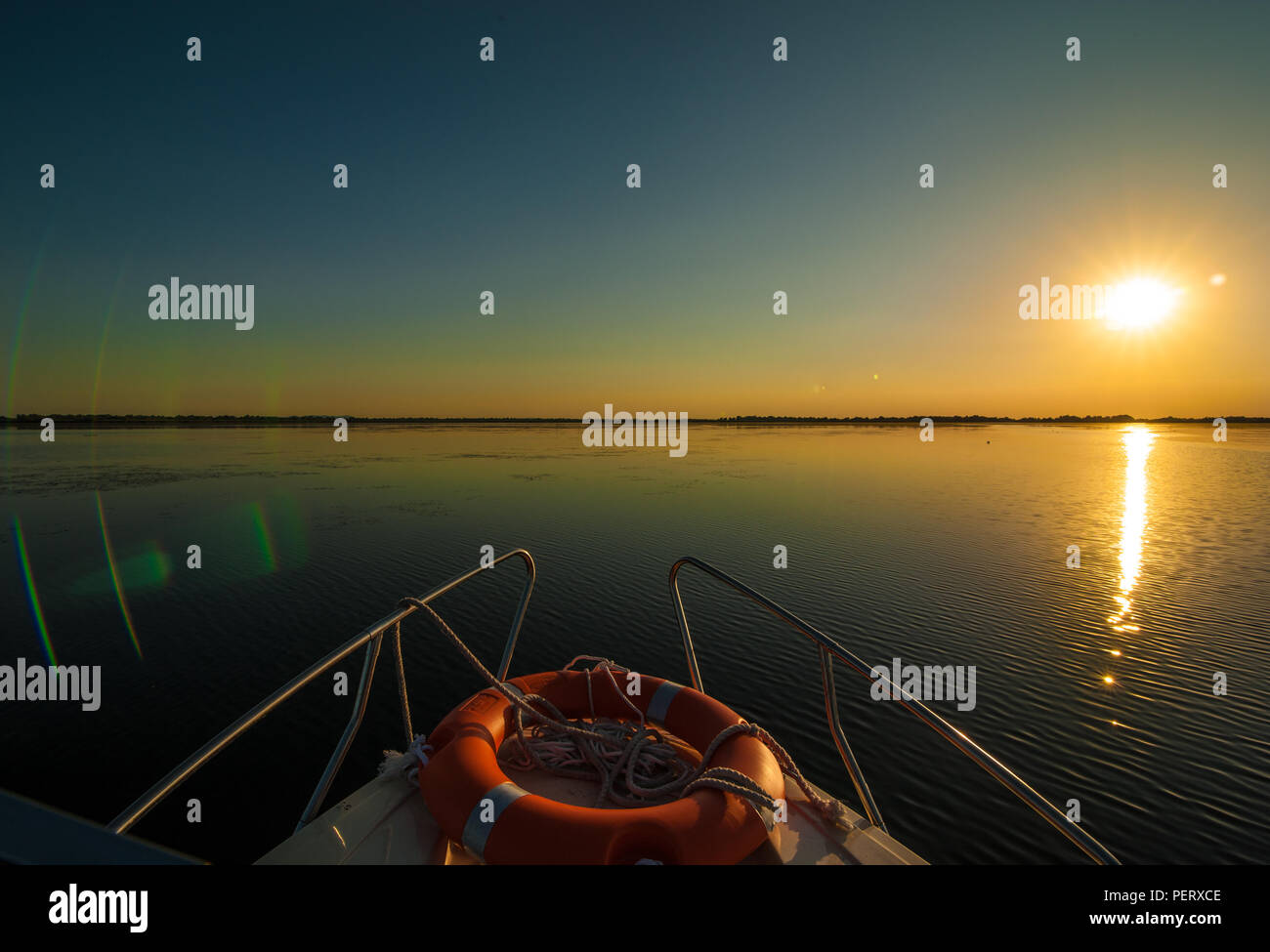 sunset in the Danube delta Romania.Beautiful blueish lights in water ...