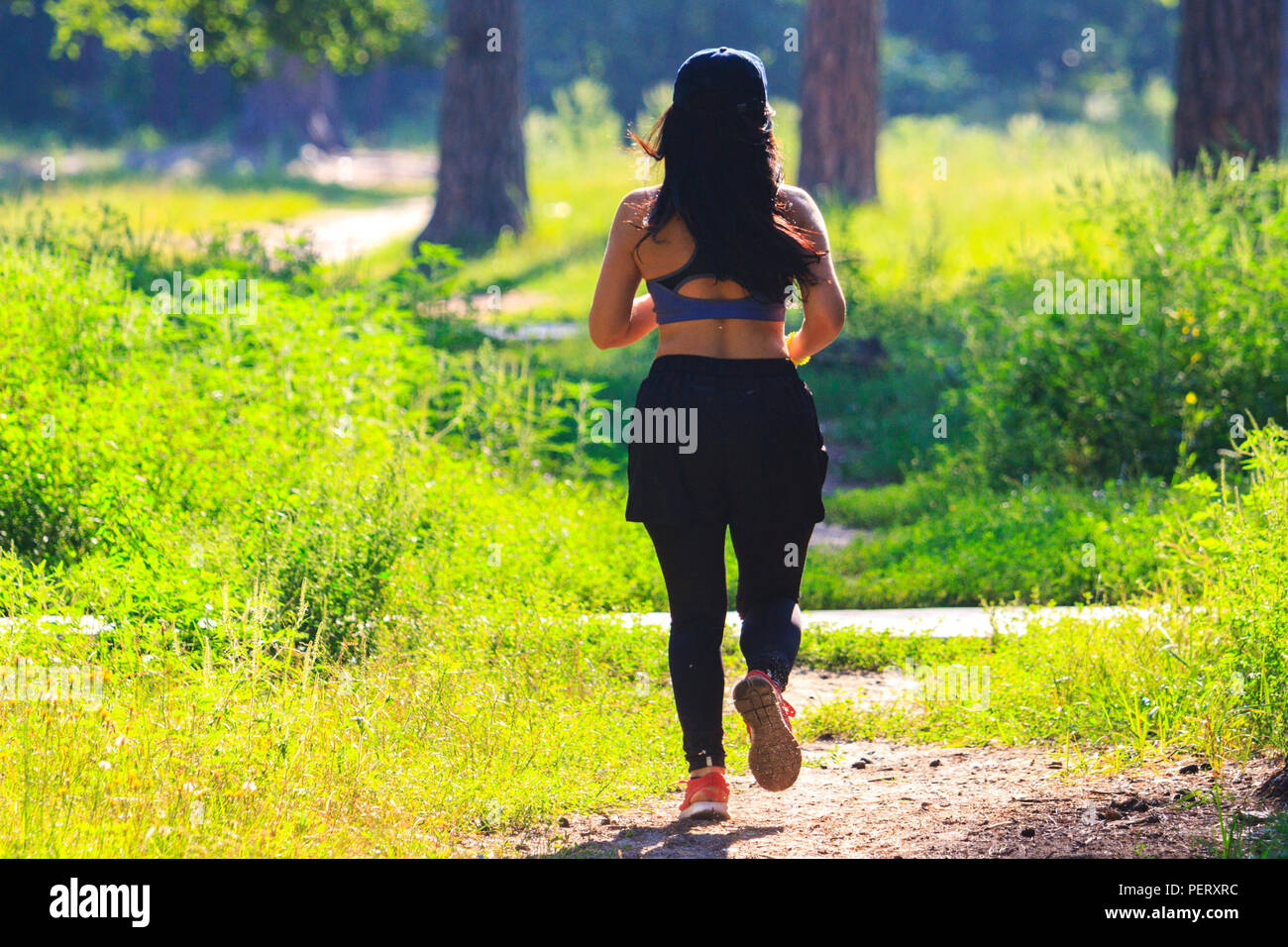 outdoor workout, girl running in the park Stock Photo - Alamy