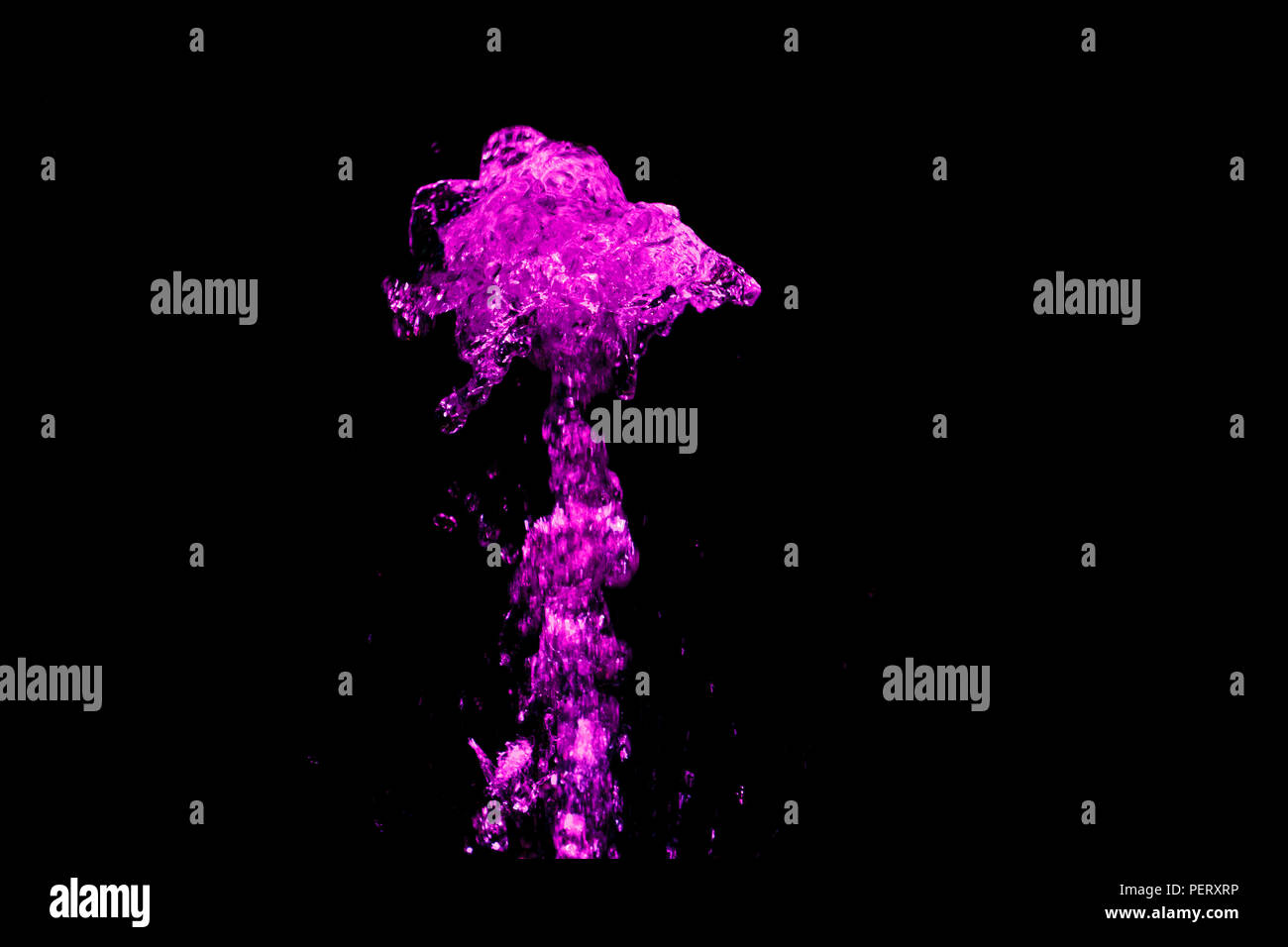 purple splashes of water on a black background Stock Photo - Alamy