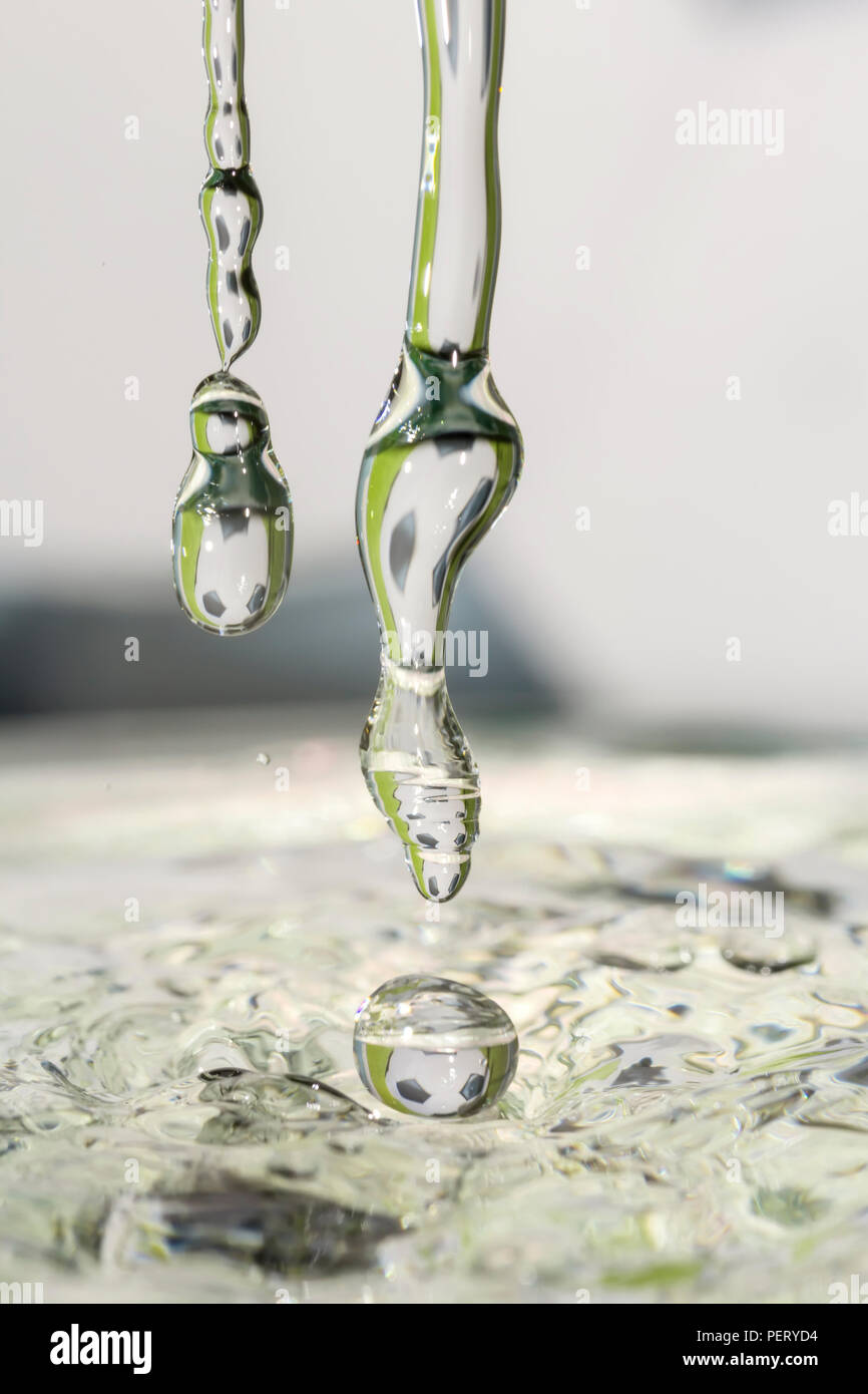 Lightweight football. Drops of clear water with reflection of soccer ...