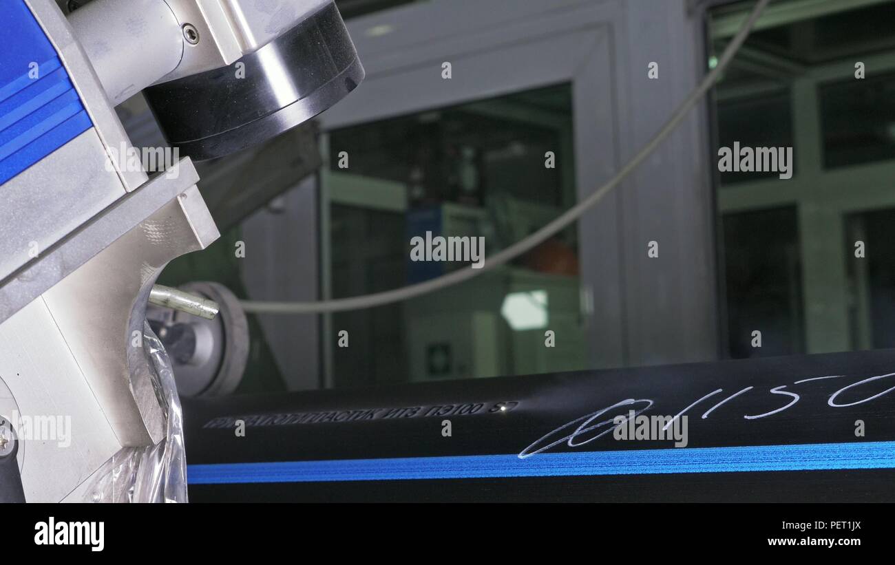 Laser Marking Machine Engraving. Manufacture of plastic water pipes ...