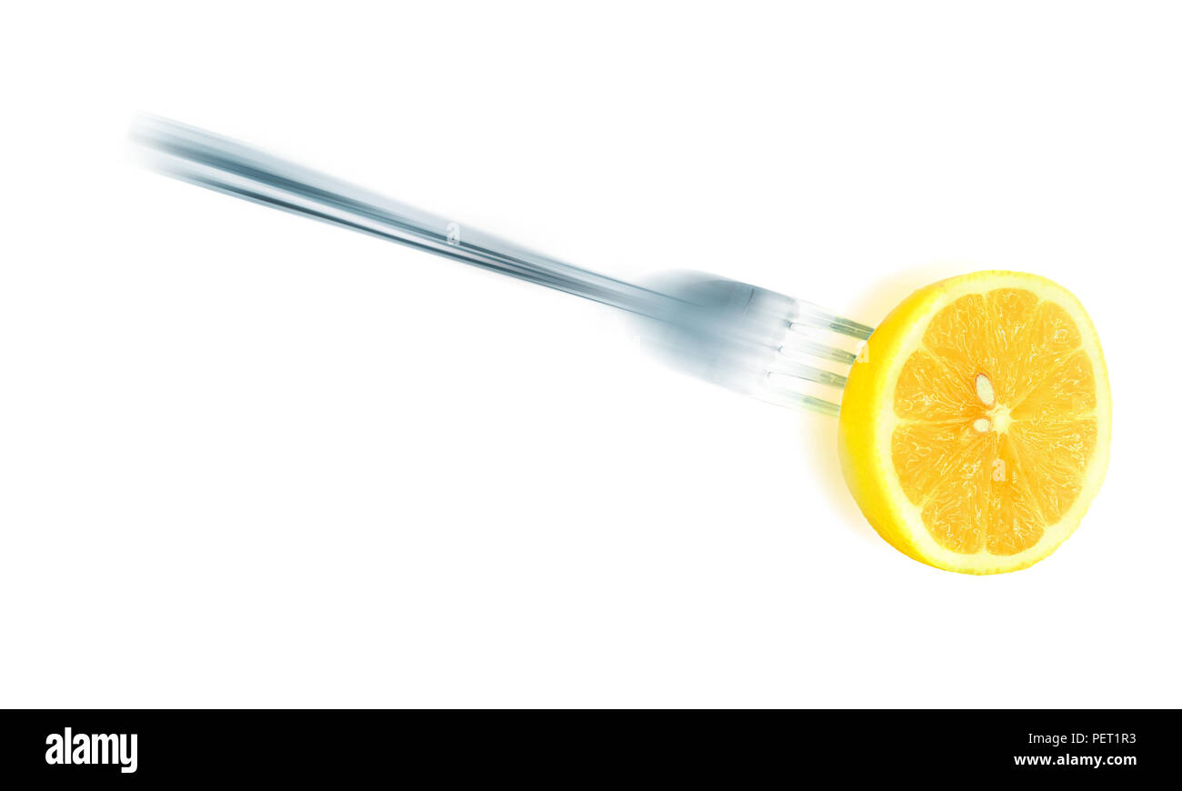 lemon on the fork Stock Photo - Alamy