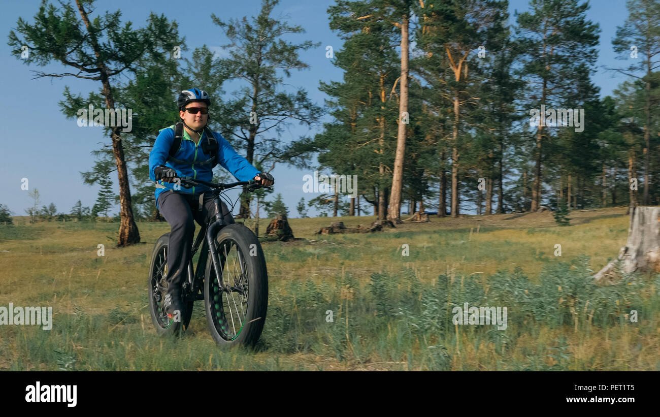Fat bike also called fatbike or fat-tire bike in summer riding in the ...